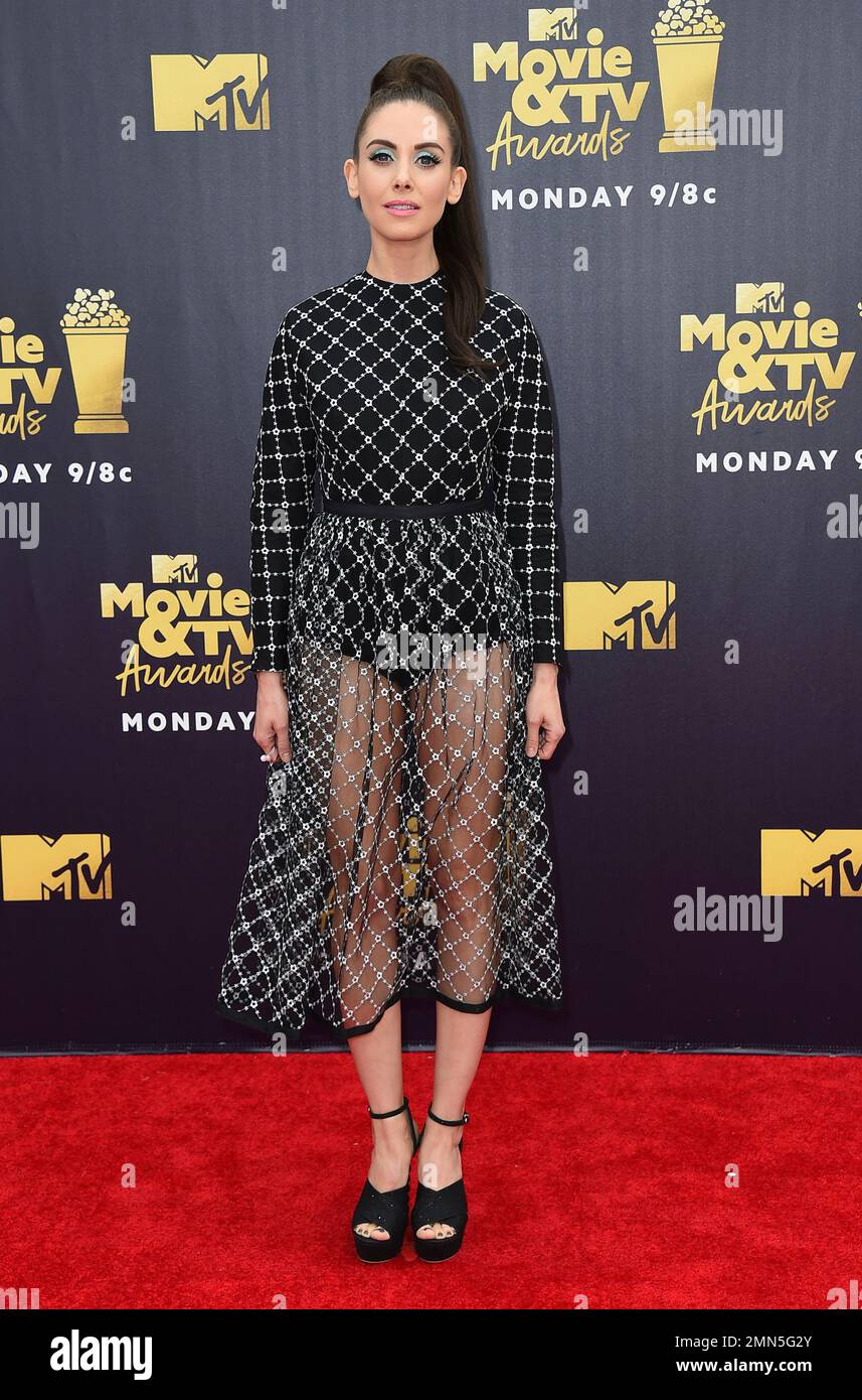 Alison Brie arrives at the MTV Movie and TV Awards at the Barker Hangar ...