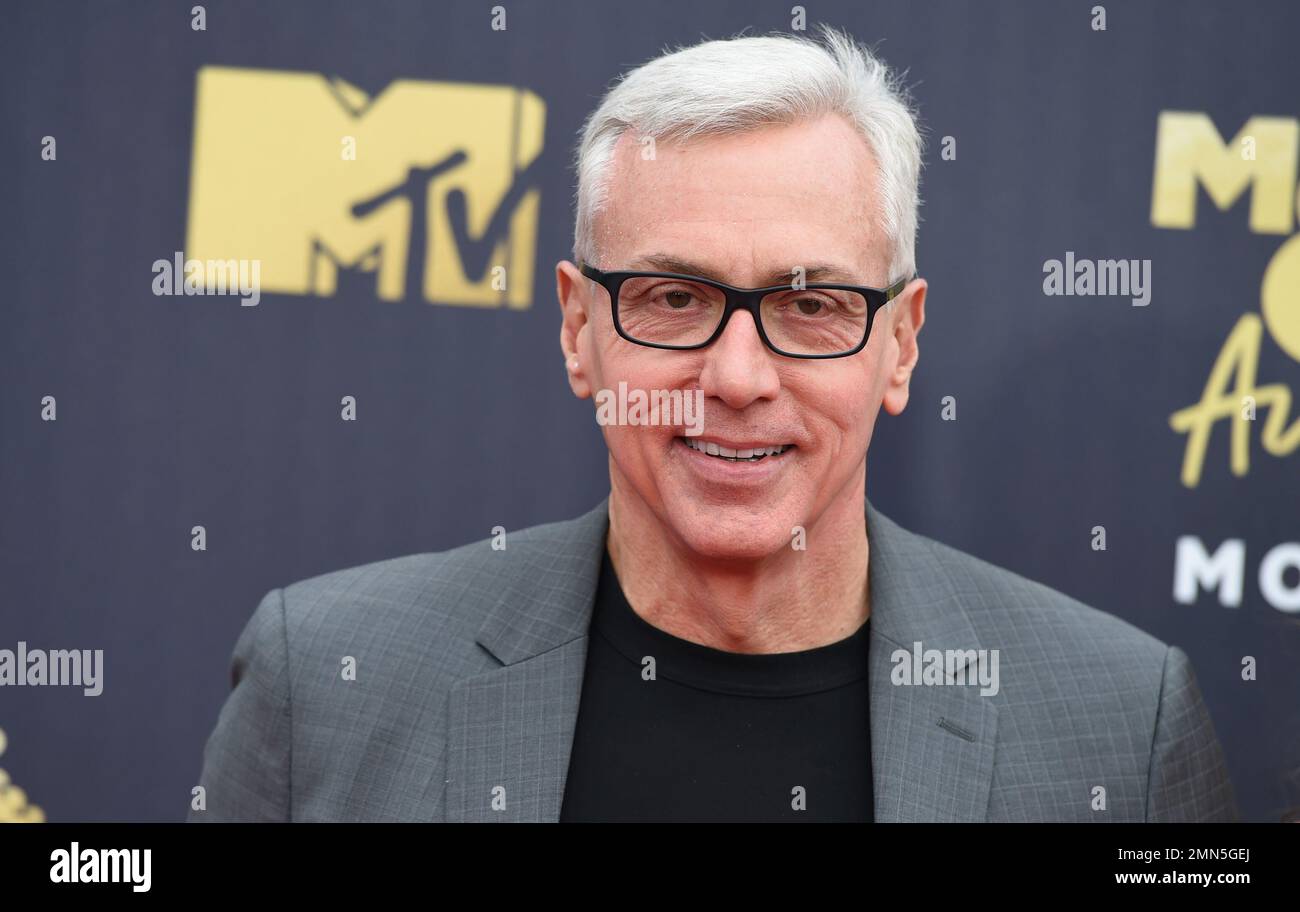 Drew Pinsky arrives at the MTV Movie and TV Awards at the Barker Hangar ...
