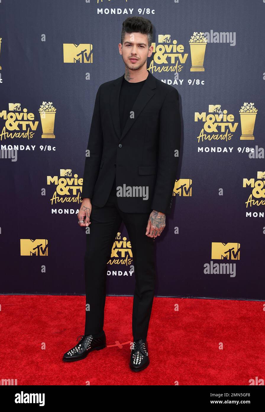 Travis Mills arrives at the MTV Movie and TV Awards at the Barker ...