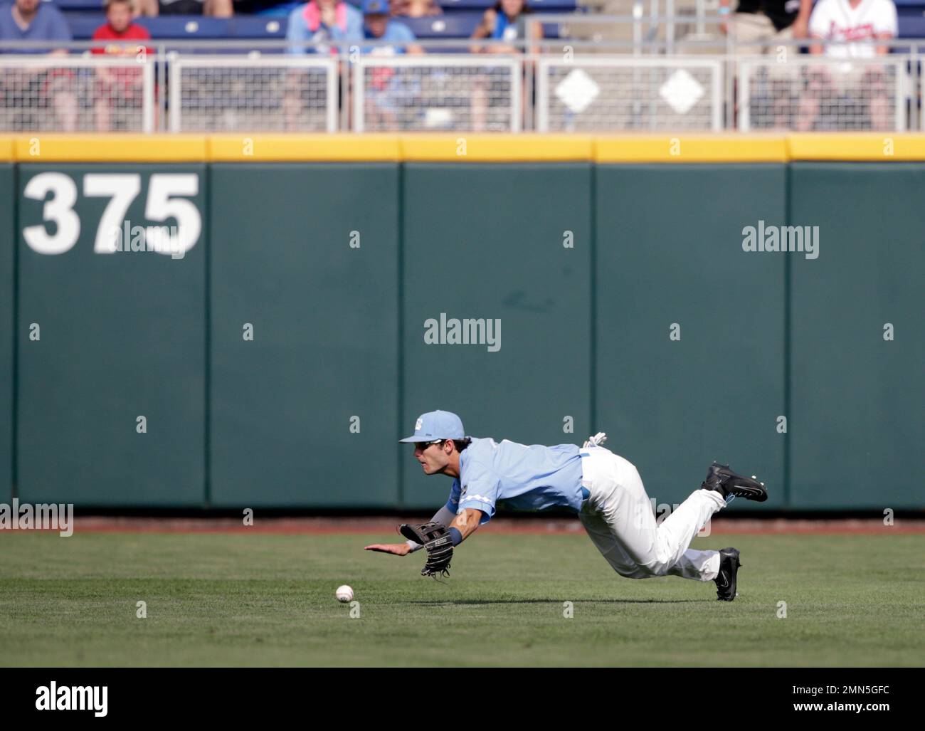 North Carolina center fielder Brandon Riley misses a ball hit for a ...