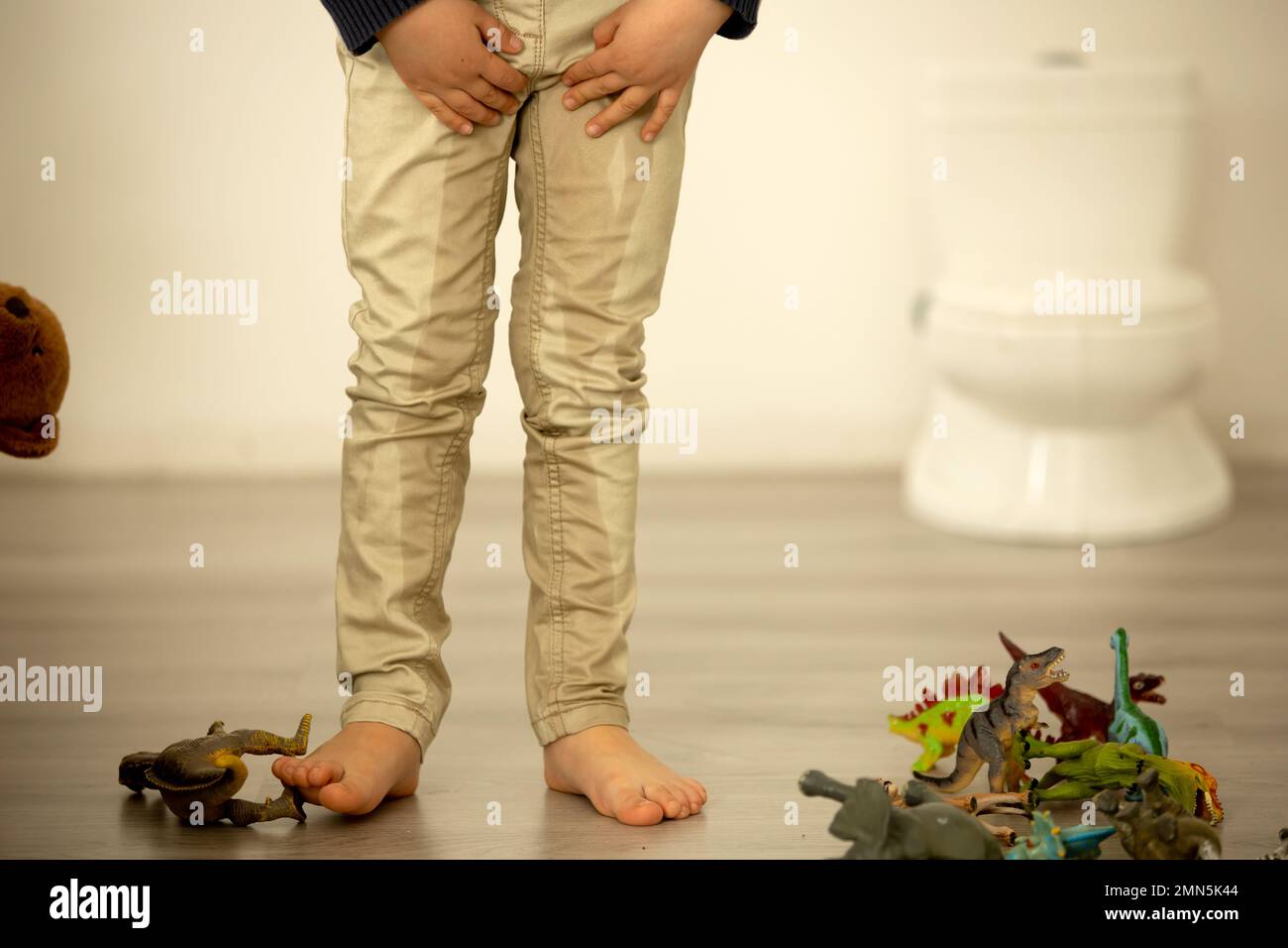 Little toddler child, boy, pee in his pants while playing with toys ... Little toddler child, boy, pee in his pants while playing with toys ...