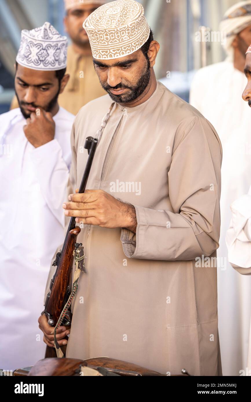 Nizwa, Oman, 2nd December 2022: omani men at the guns market Stock ...