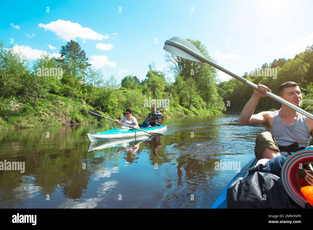 Family kayak trip. Father and daughter, and elderly couple senior and ...