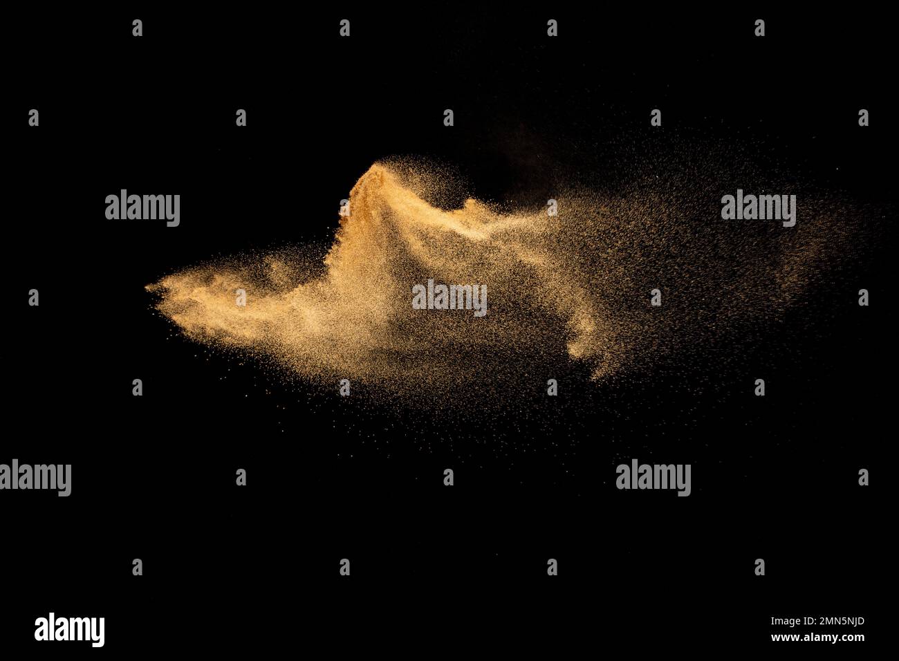 Dry river sand explosion.Brown color sand splash against black ...