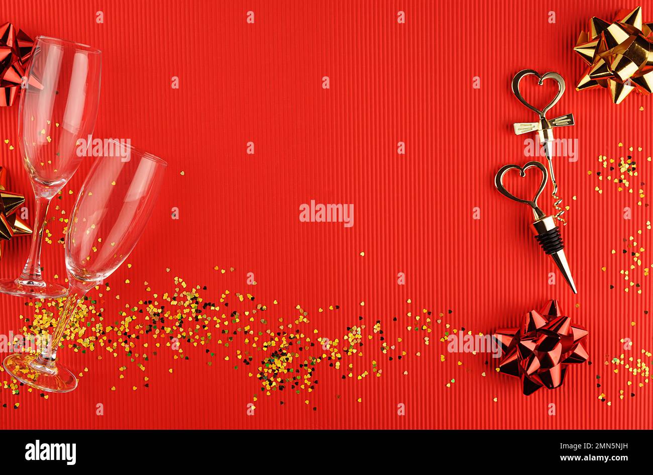 Still life with two empty glasses, a cork and a corkscrew with heart ...