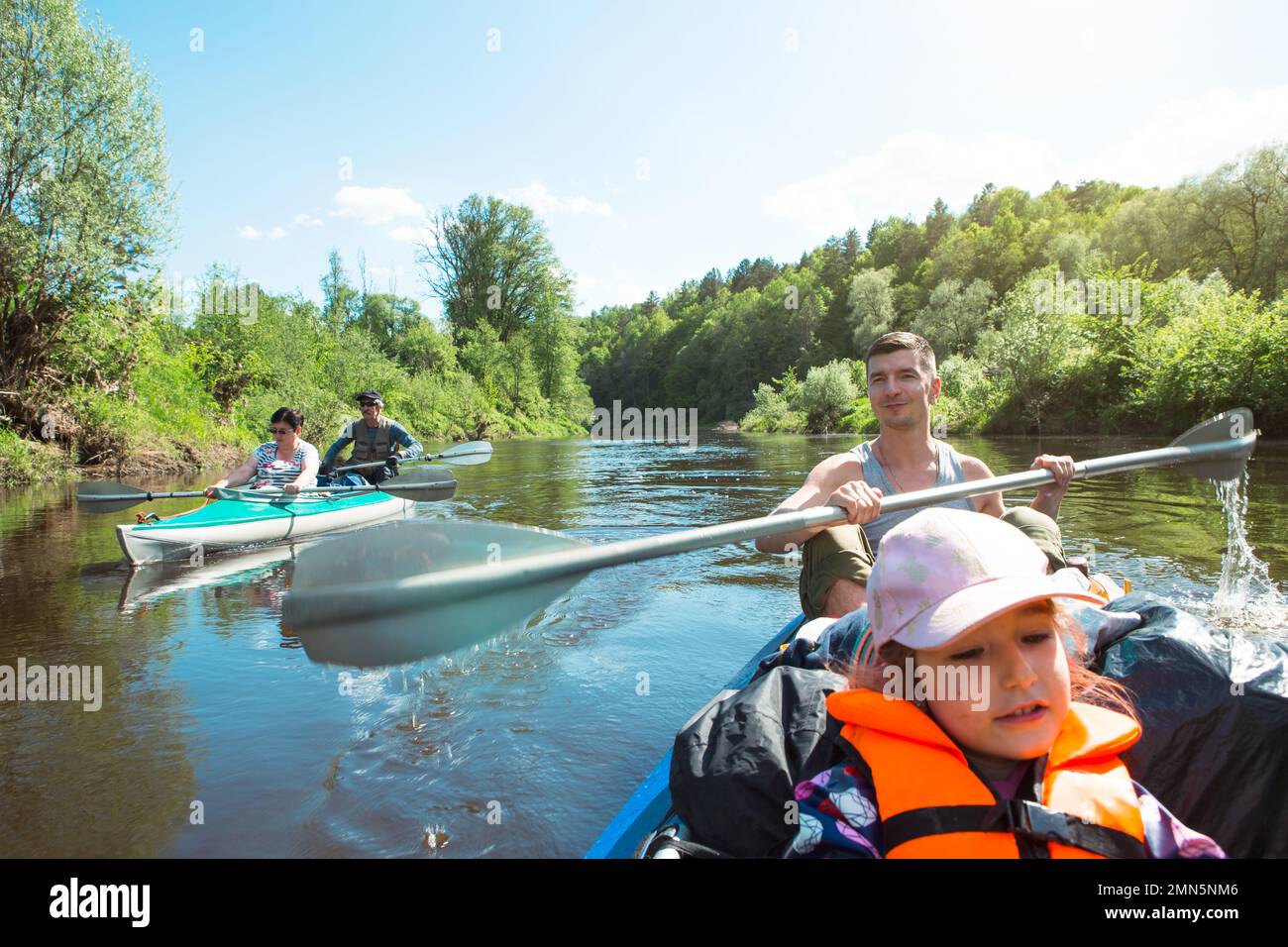 Family kayak trip. Father and daughter, and elderly couple senior and ...
