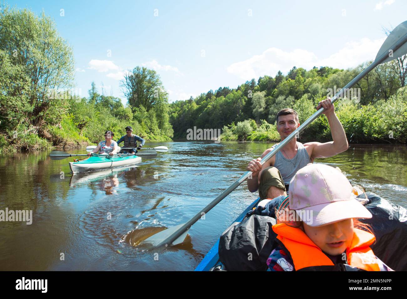 Family kayak trip. Father and daughter, and elderly couple senior and ...