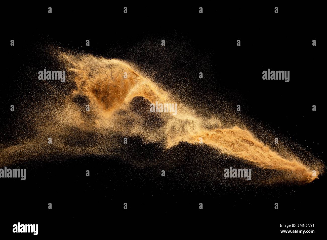 Dry river sand explosion.Brown color sand splash against black ...
