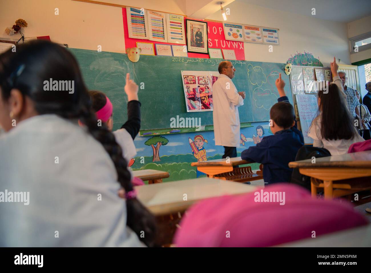 A teacher instructs students in Oudja, Morocco, in September 2022 ...