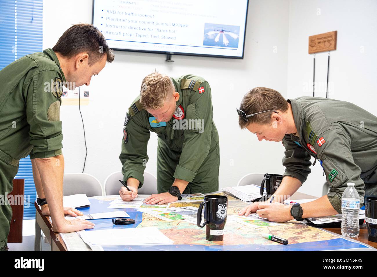 Aircrew members with the Royal Danish Air Force’s 721 Squadron, conduct ...