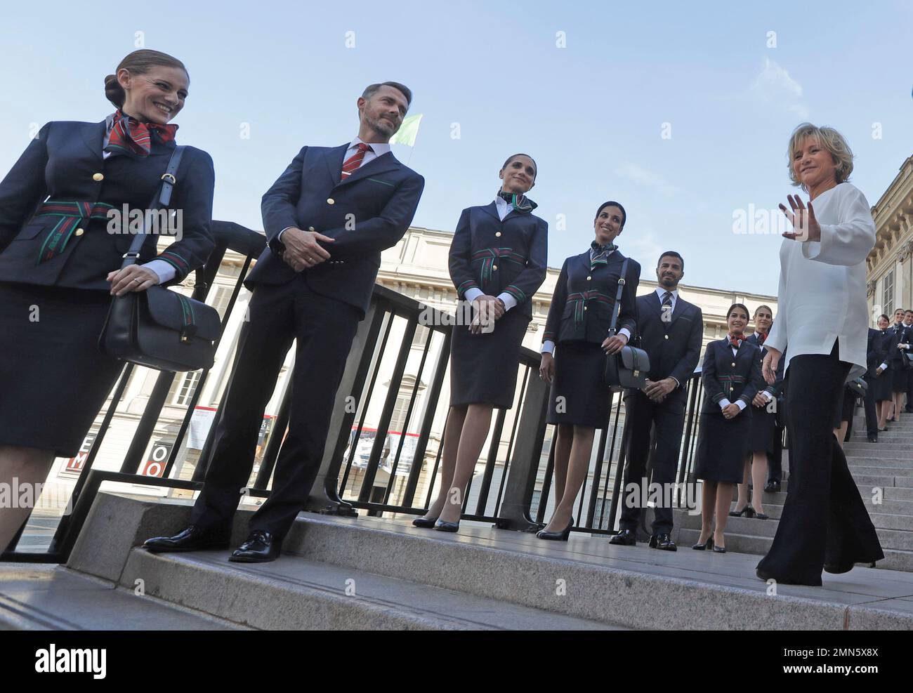 Italian fashion designer Alberta Ferretti, right, presents the new ...