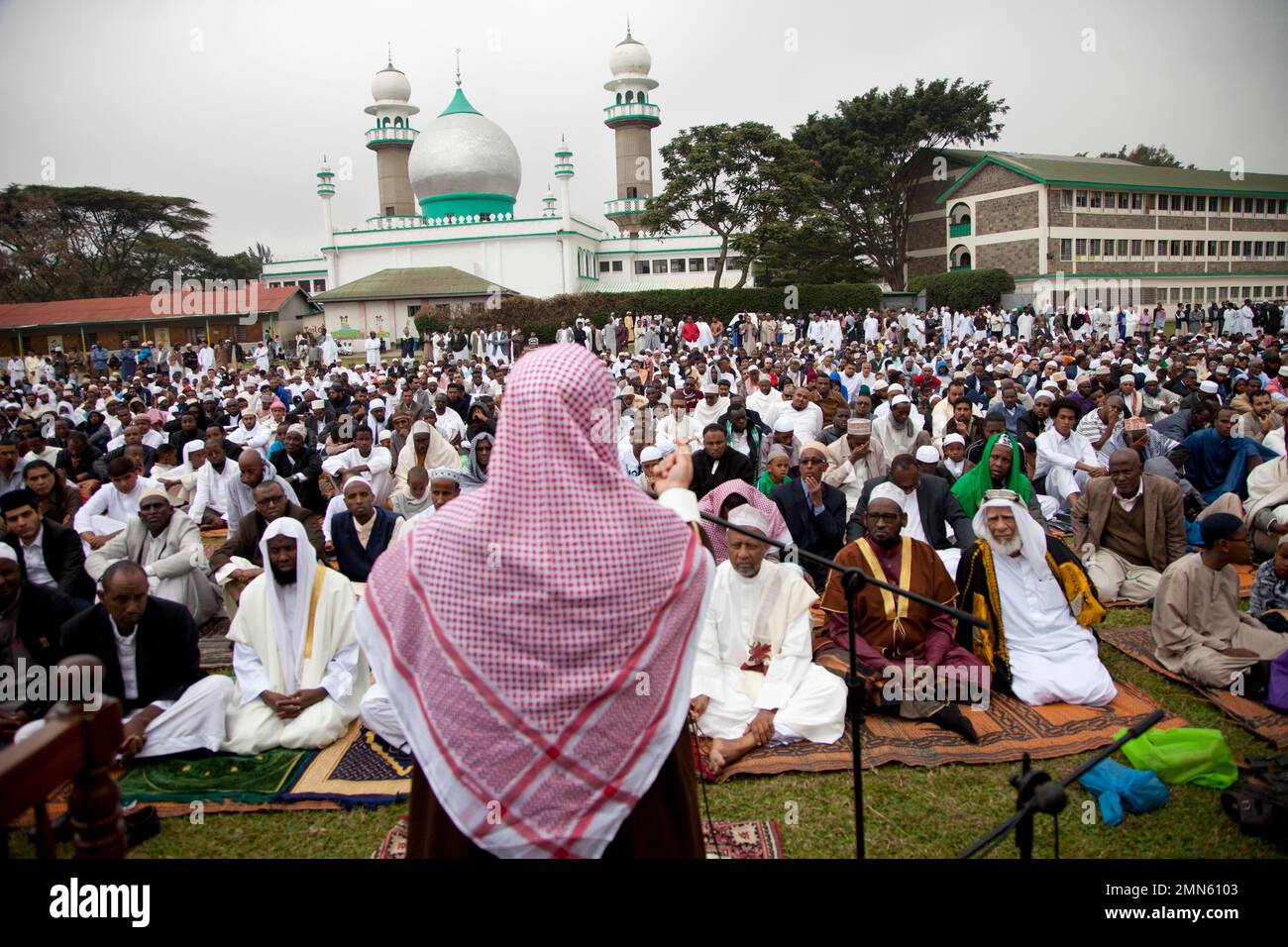 Kenyan Muslims listen to the Imam as he delivers sermon during the Eid ...