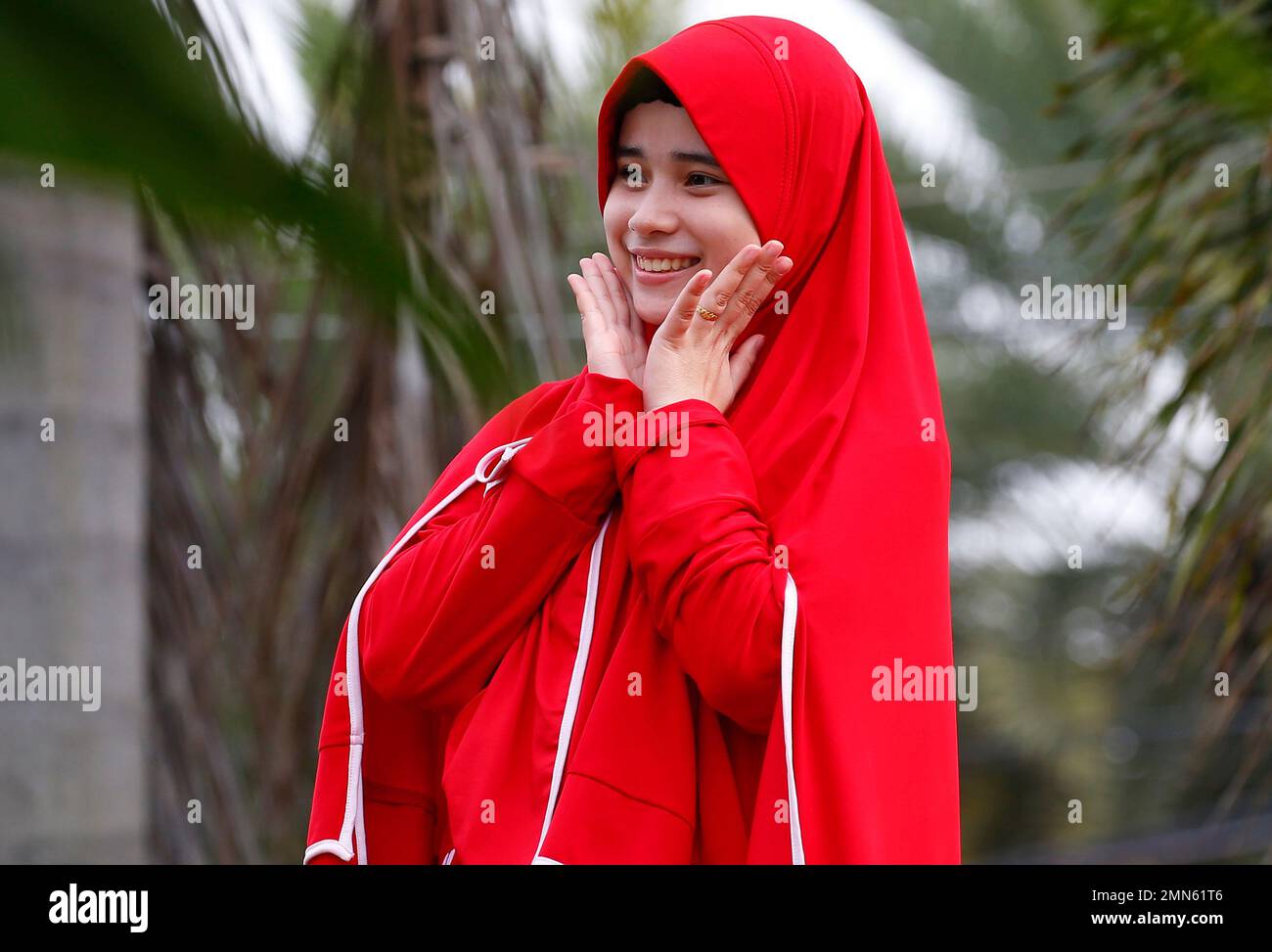 A Filipino Muslim poses following prayers to celebrate the end of the ...