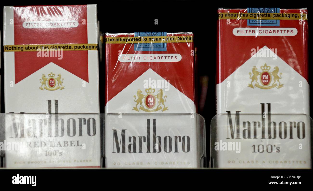 This Thursday, June 14, 2018, photo shows packs of Marlboro cigarettes ...