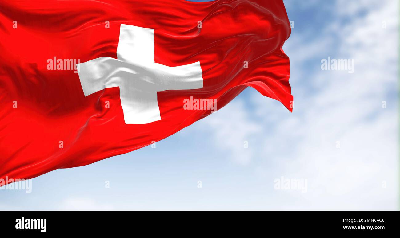 Close-up view of the swiss national flag waving in the wind ...