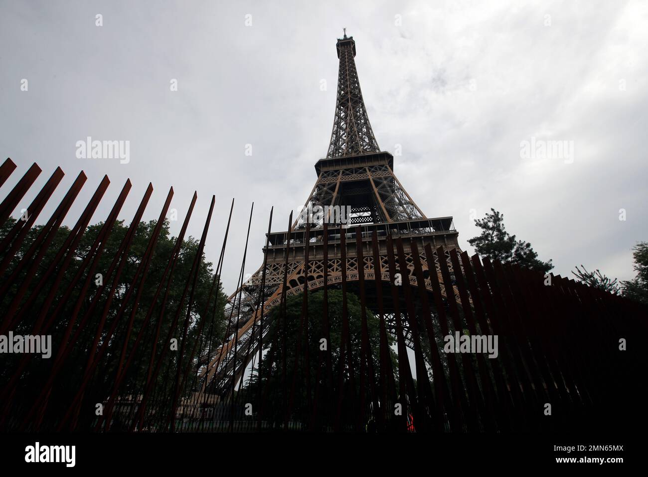View of a new metal barrier under construction around the Eiffel Tower ...