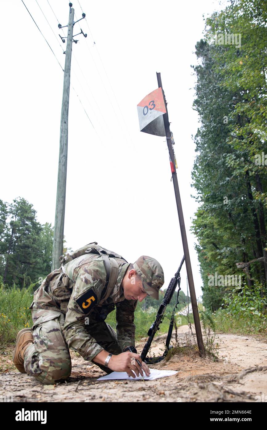 An U.S. Soldier writes the coordinate of his point during the Land ...