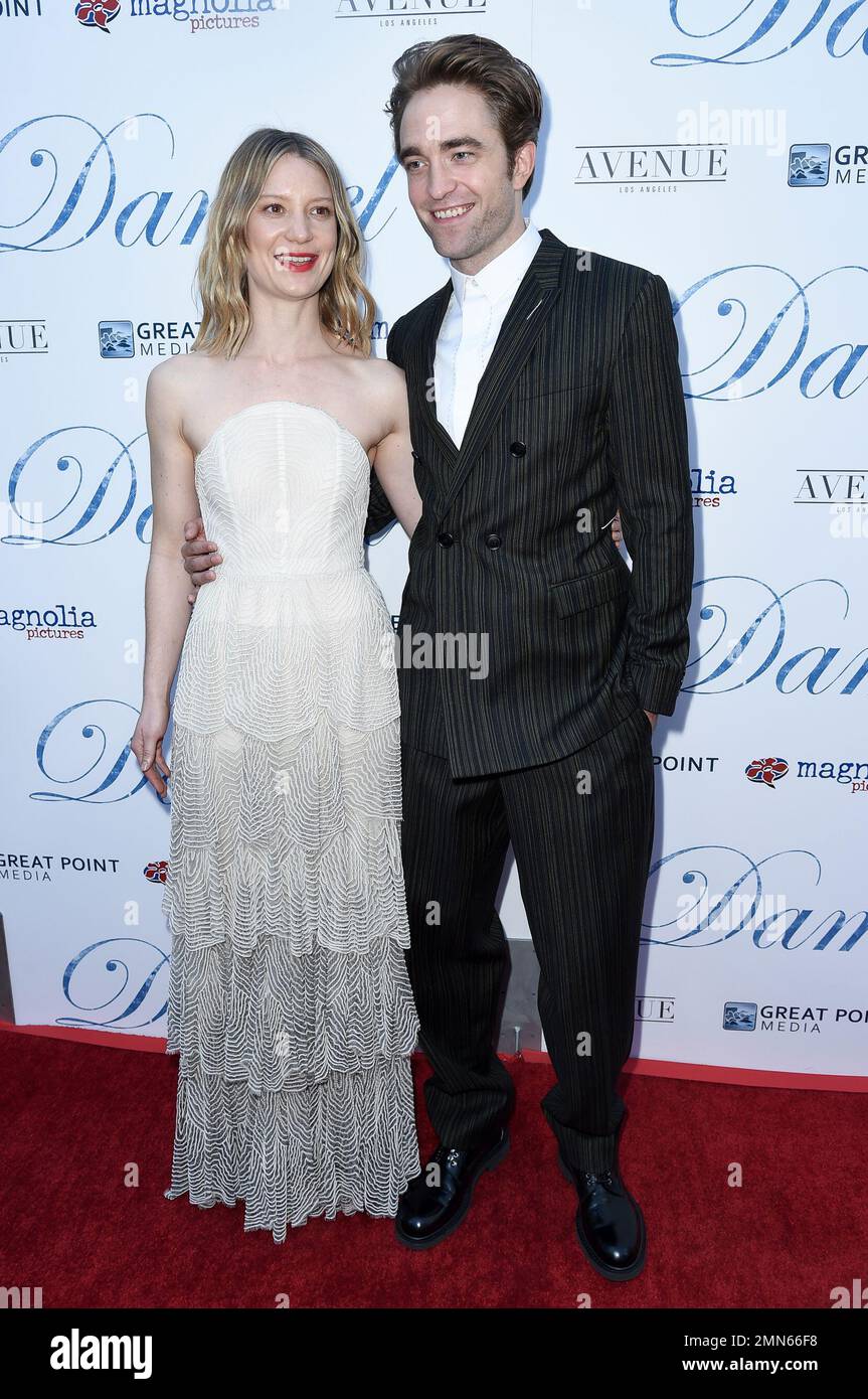 Mia Wasikowska, left, and Robert Pattinson attend the LA Premiere of ...