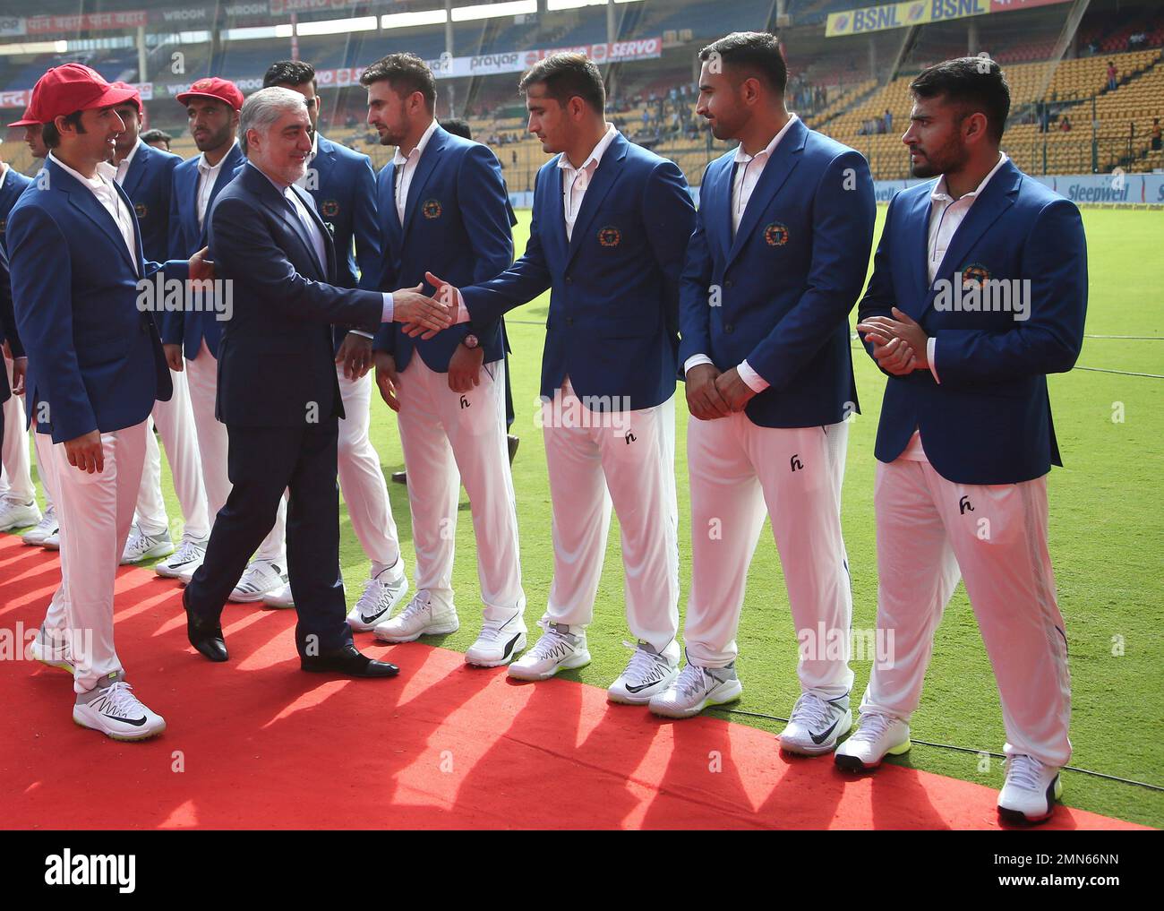 Afghanistan cricket team captain Asghar Stanikzai, left, introduces his team members to ...