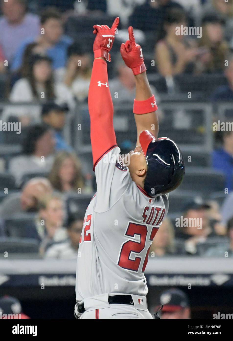 Washington Nationals' Juan Soto gestures as he comes home after hitting ...