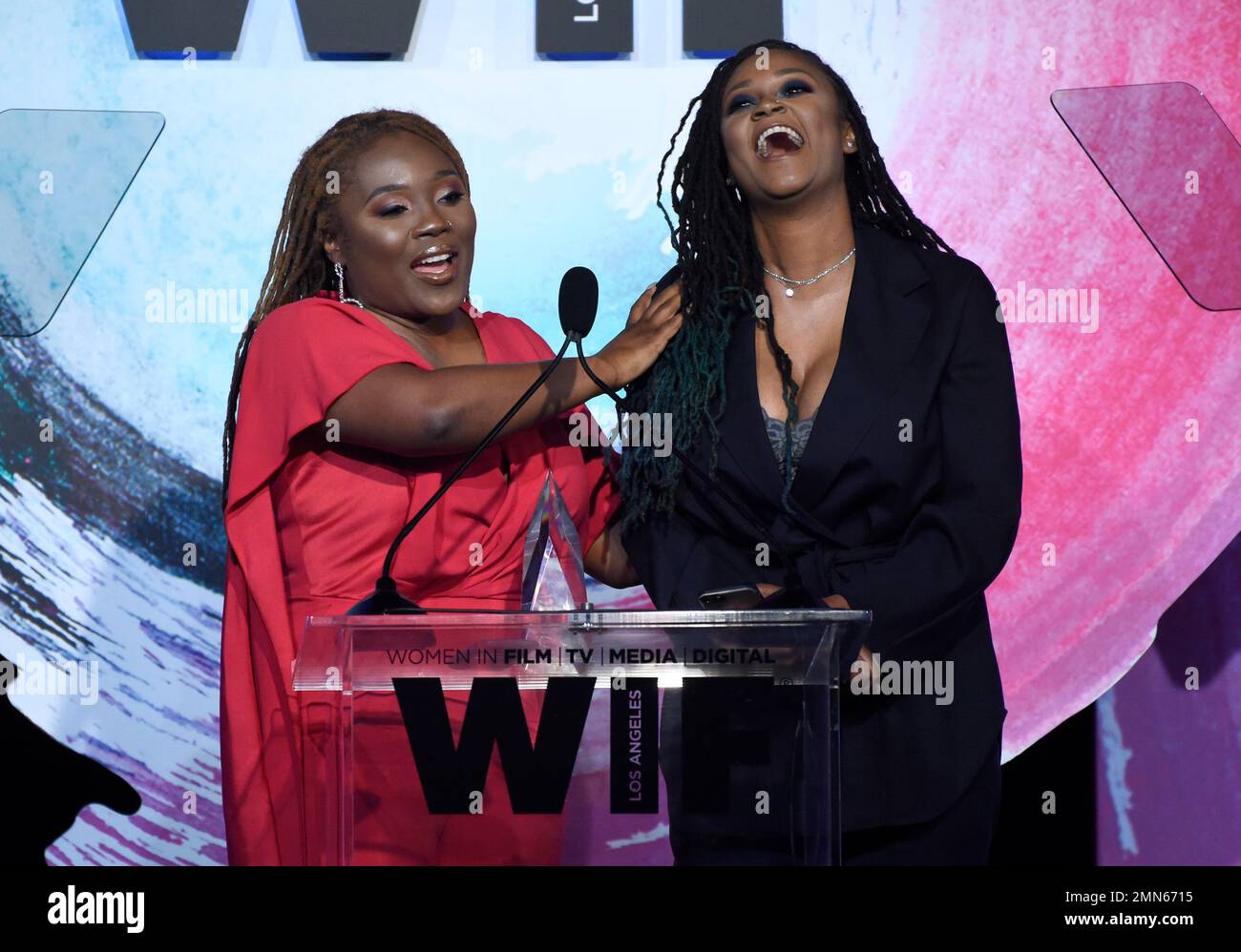 Denisea "Blu June" Andrews, left, and Brittany Chi Coney accept the ...