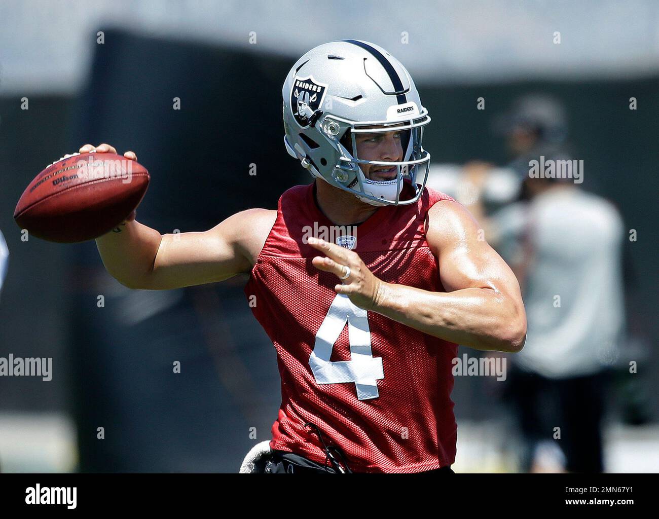 Oakland Raiders quarterback Derek Carr passes at the NFL football team ...