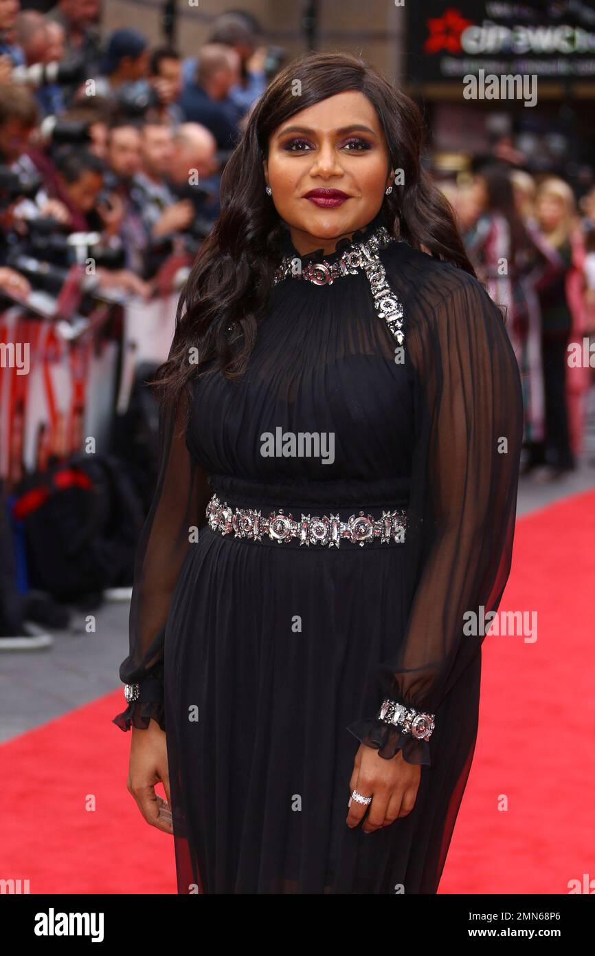 Actress Mindy Kaling poses for photographers upon arrival at the ...