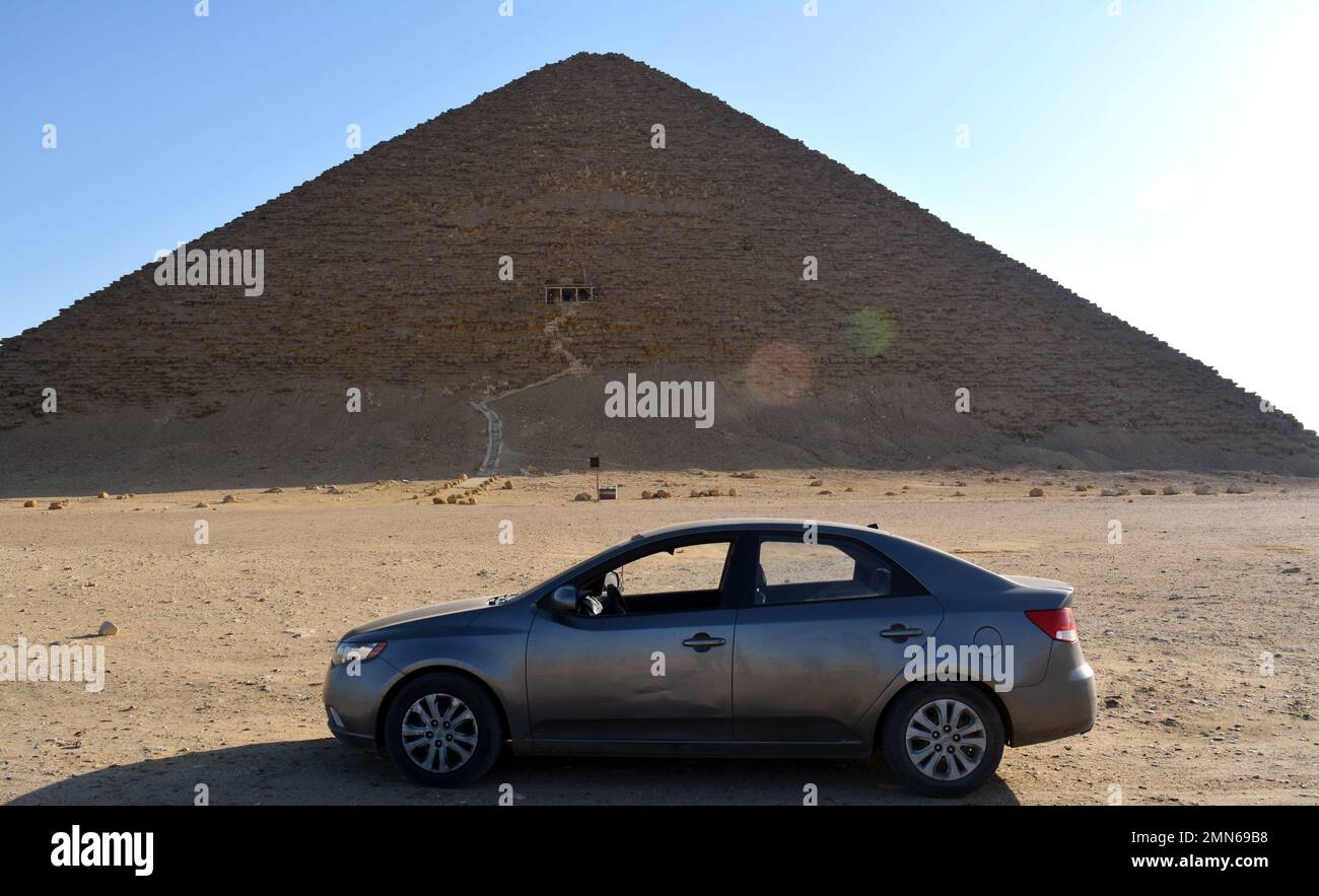 Giza, Egypt, January 26 2023: KIA Cerato car in front of The red north ...