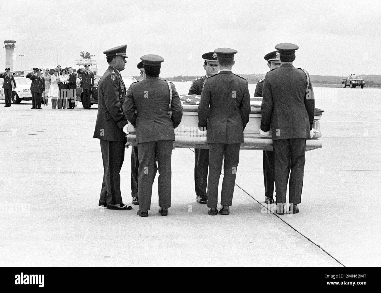 Military pallbearers carry the casket of 1st Lt. Mark Barrett as his ...