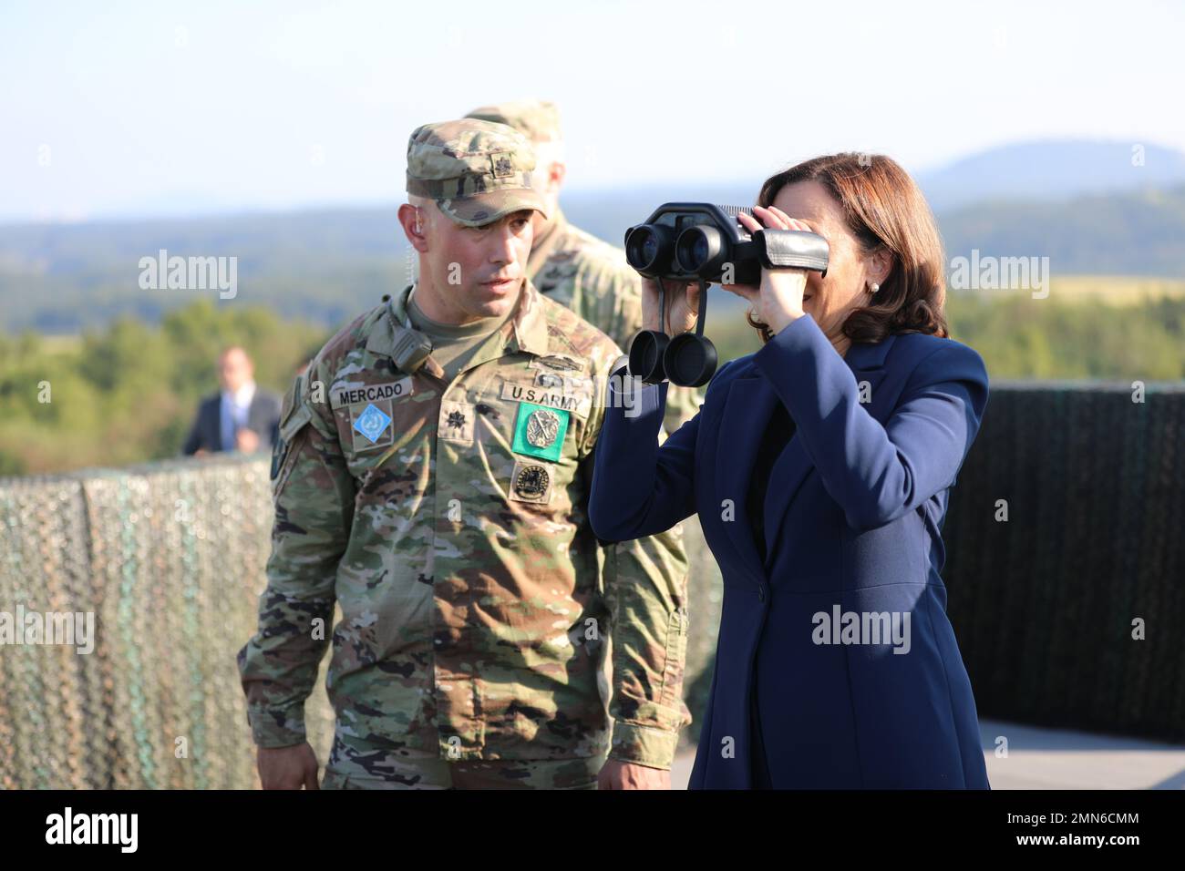 U.S. Vice President Kamala Harris and U.S. Lt. Col. Chris Mercado view the two Korean borders ...