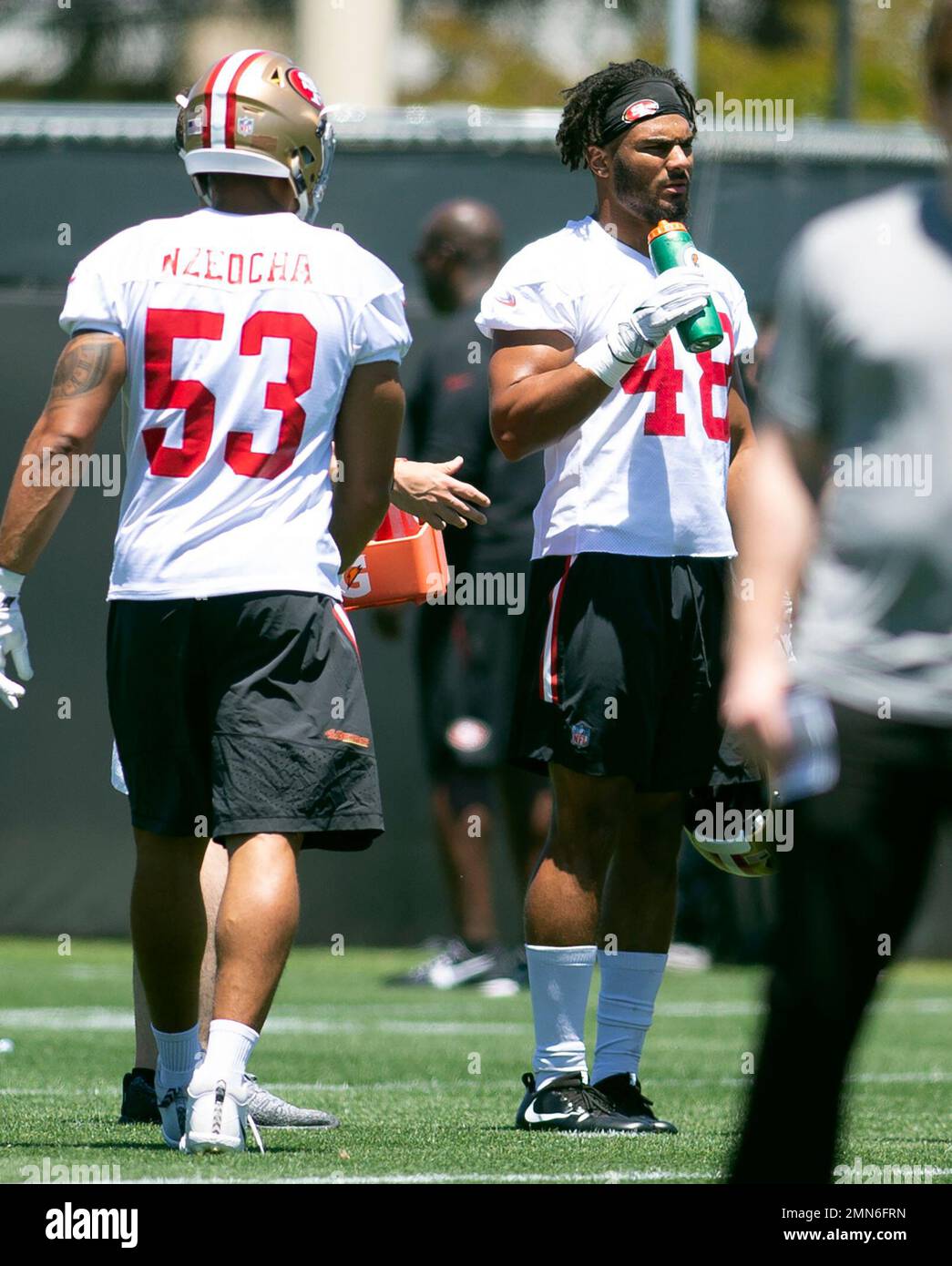 San Francisco 49ers linebacker Fred Warner (48) takes a water break ...