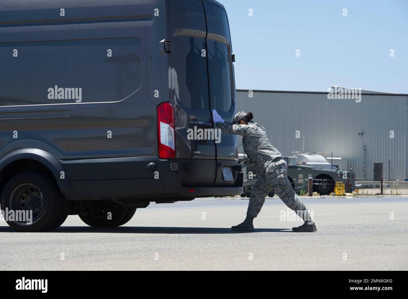 Air Force Airman 1st Class Ashley Conzales closes the door of the ...