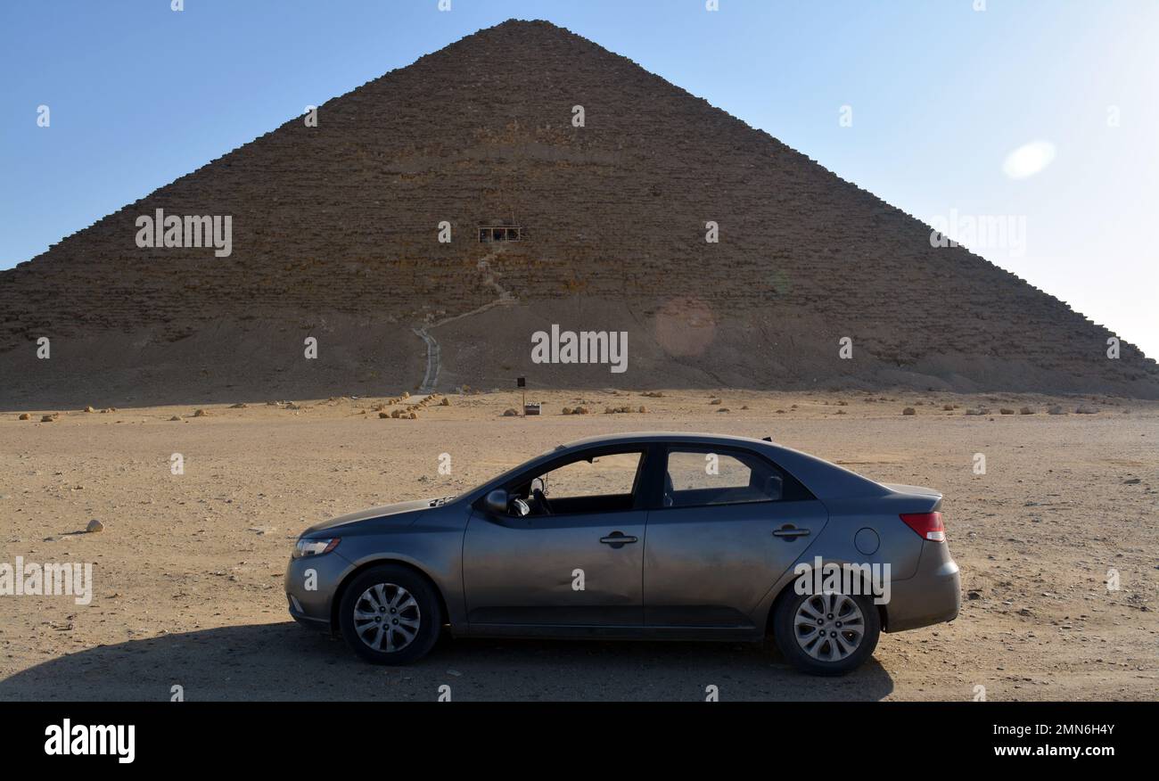 Giza, Egypt, January 26 2023: KIA Cerato car in front of The red north ...