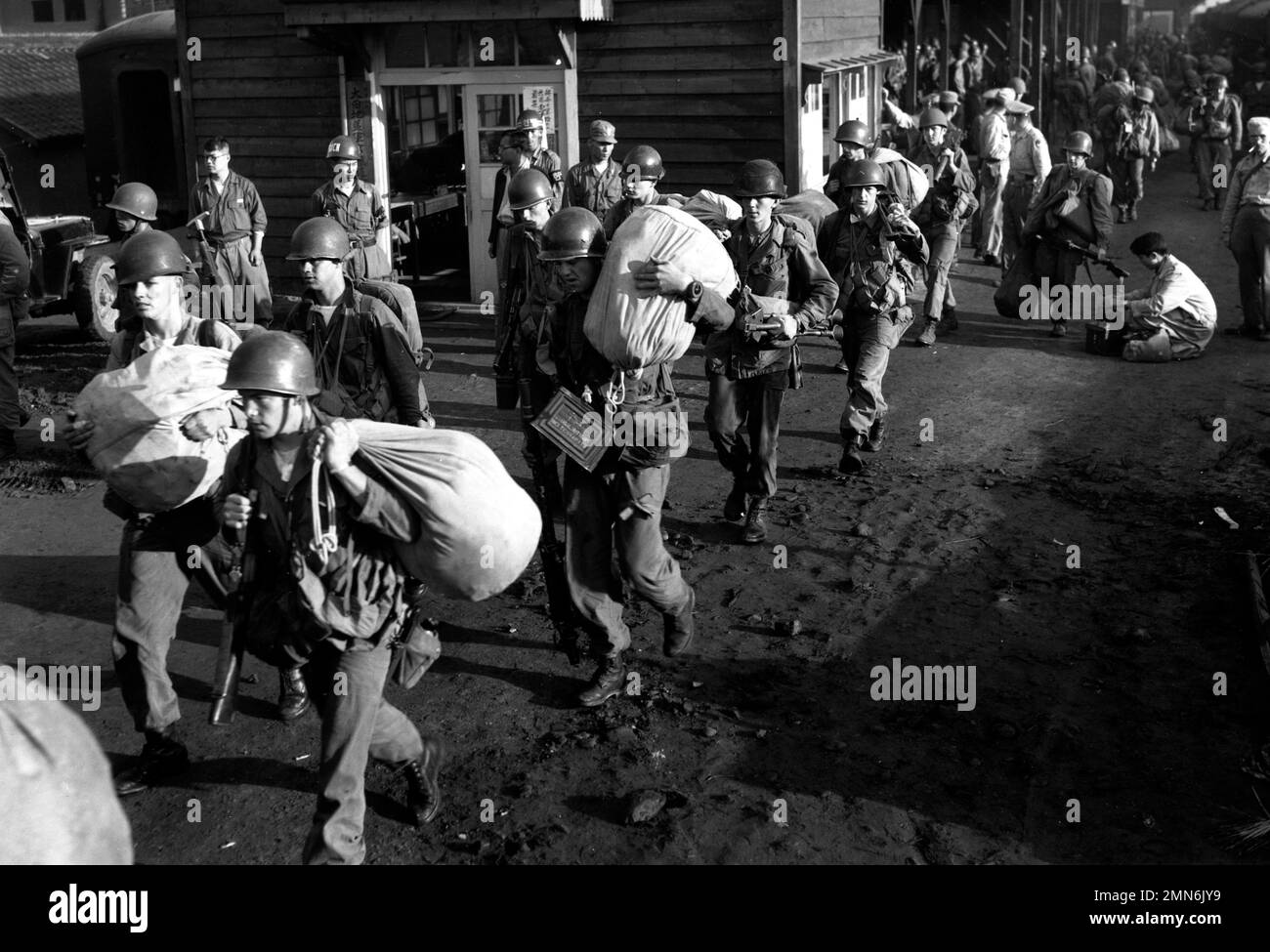 FILE - In this July 5, 1950, file photo, American foot soldiers leave ...