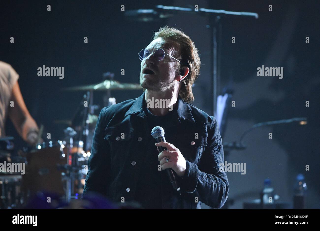 Singer Bono of U2 performs during a concert at the Apollo Theater ...