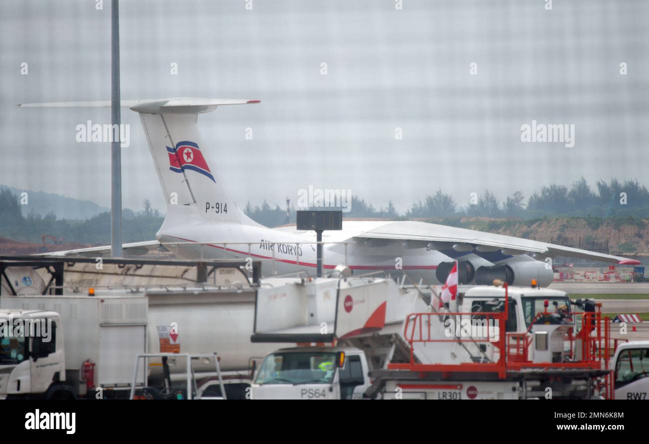 A jet airplane, partially visible, showing North Korean flag sits on ...