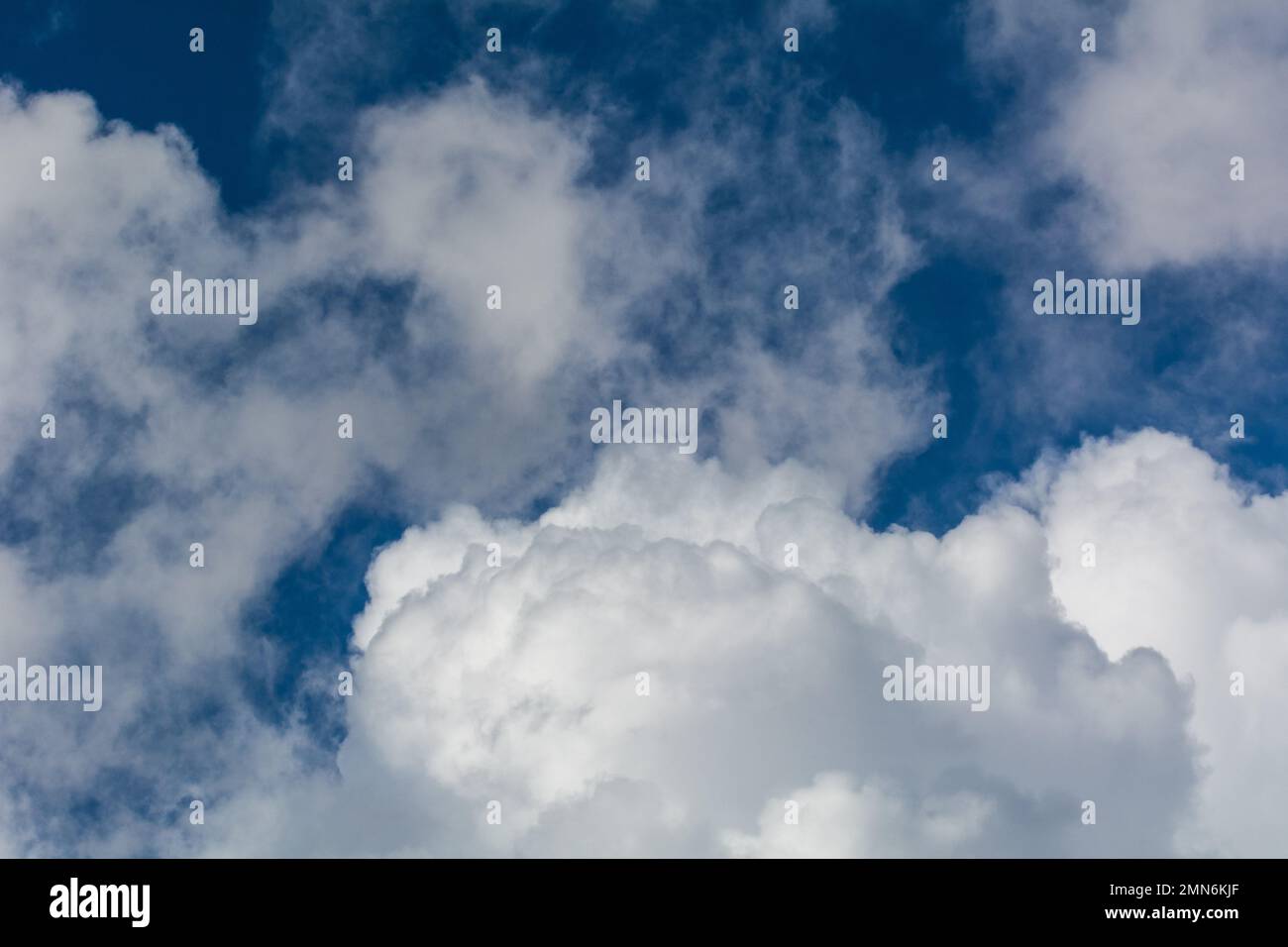 Sky and embossed clouds as a background Stock Photo - Alamy