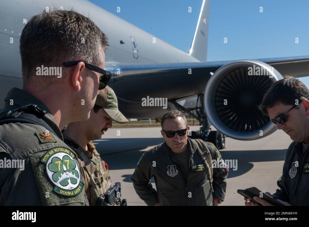 Pilots from the 77th Air Refueling Squadron go over crew manifests with ...