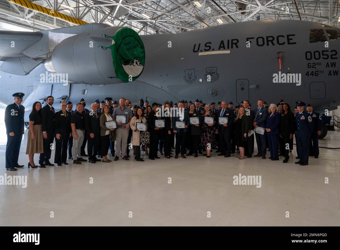 Team McChord commanders and their honorary commanders pose for a group ...
