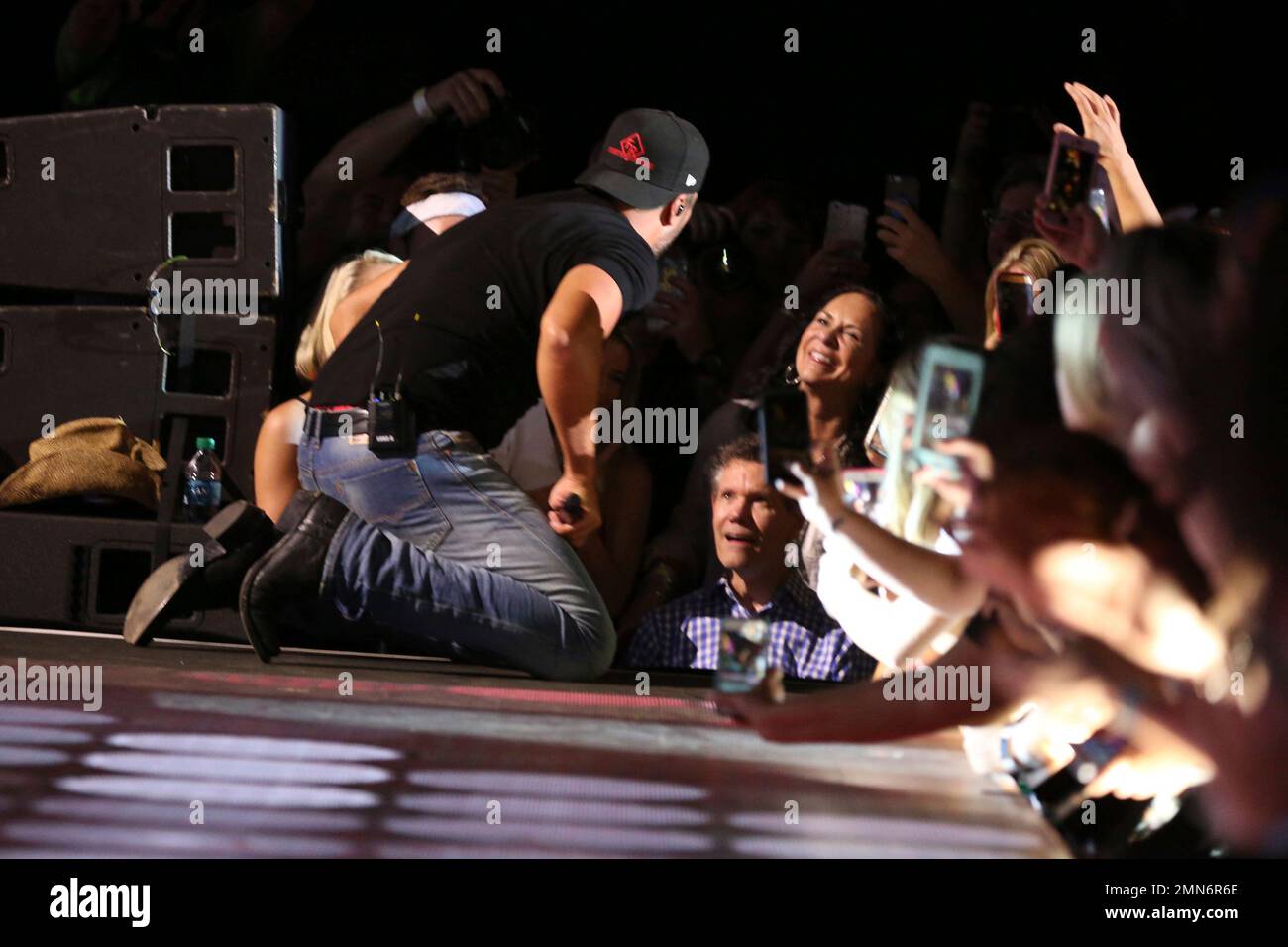 From left, artist Luke Bryan greets artist Randy Travis and wife Mary ...