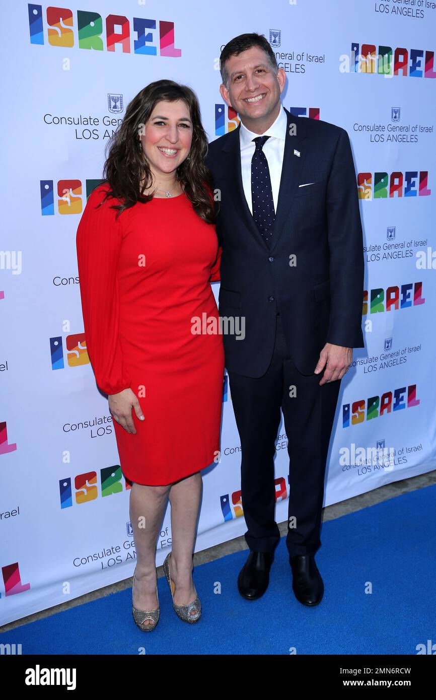Consul General of Israel Sam Grundwerg, right, and Mayim Bialik arrive ...