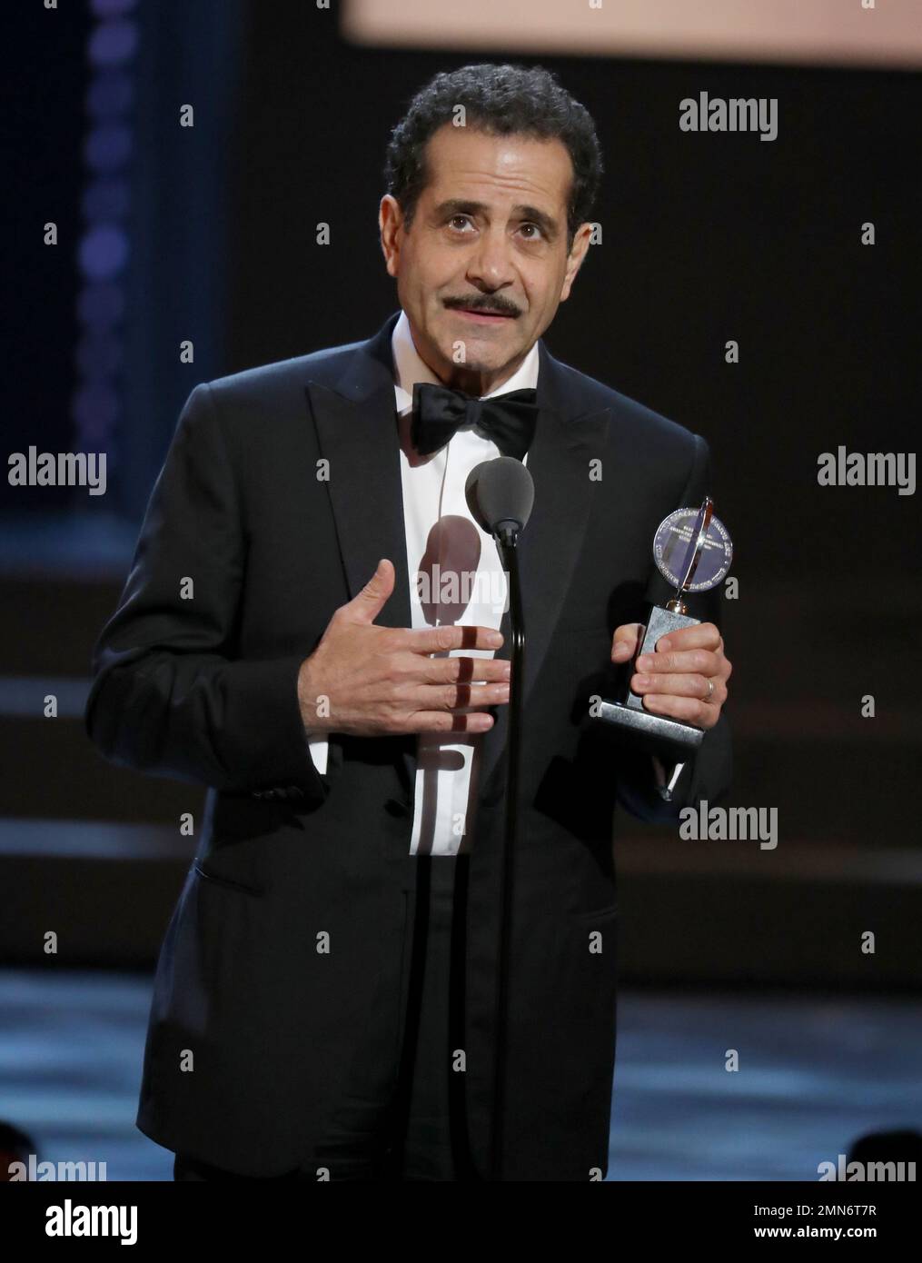 Tony Shalhoub accepts the award for leading actor in a musical at the ...