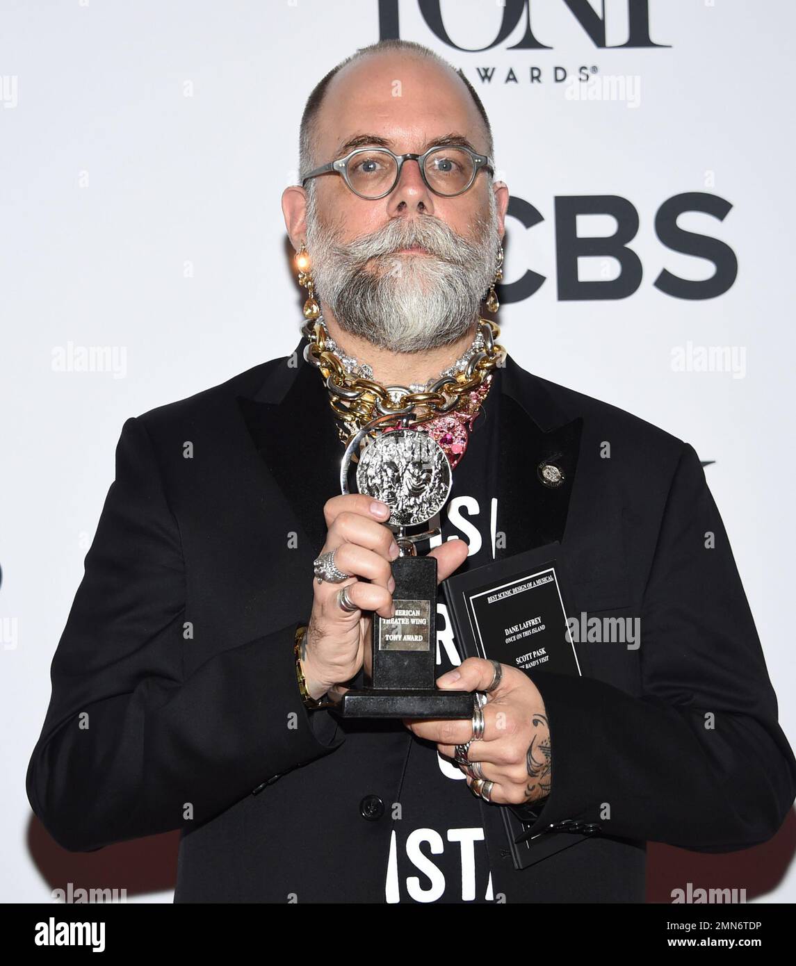 David Zinn poses in the press room with the award for best scenic ...