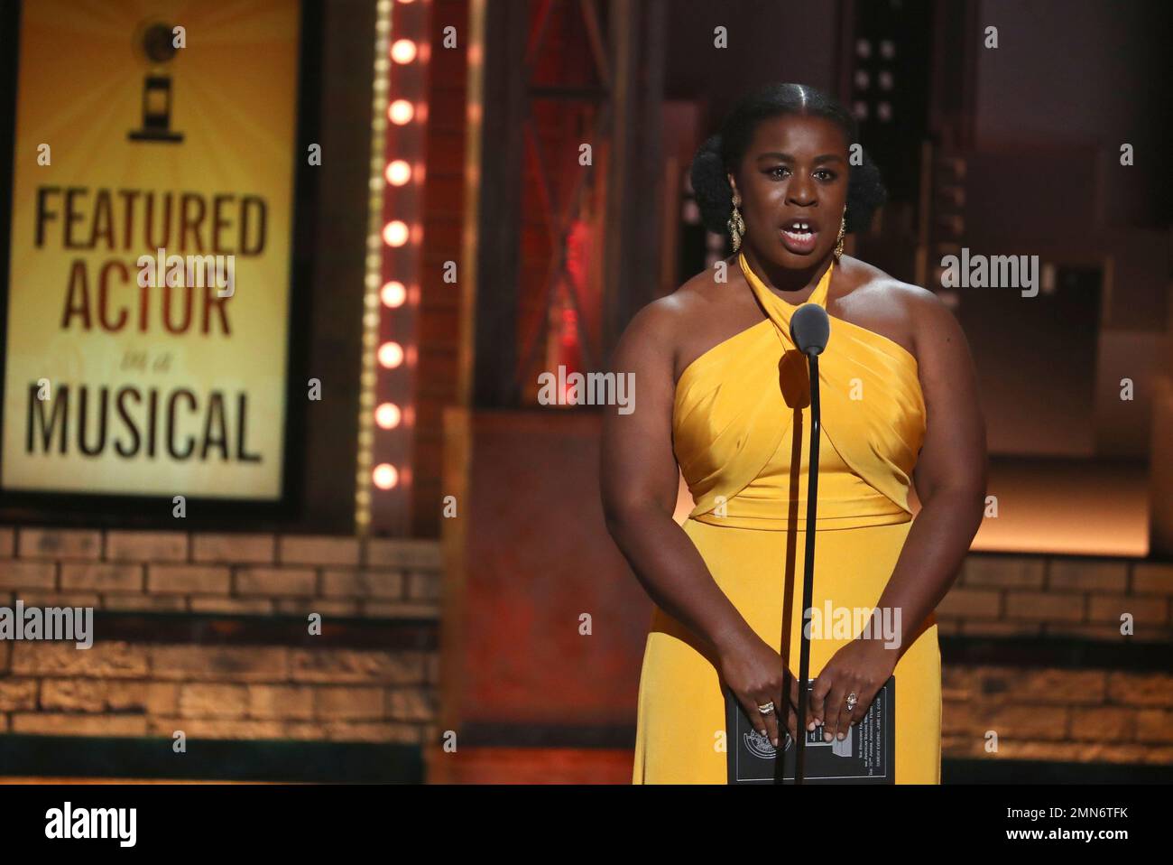 Uzo Aduba presents the award for featured actor in a musical at the ...