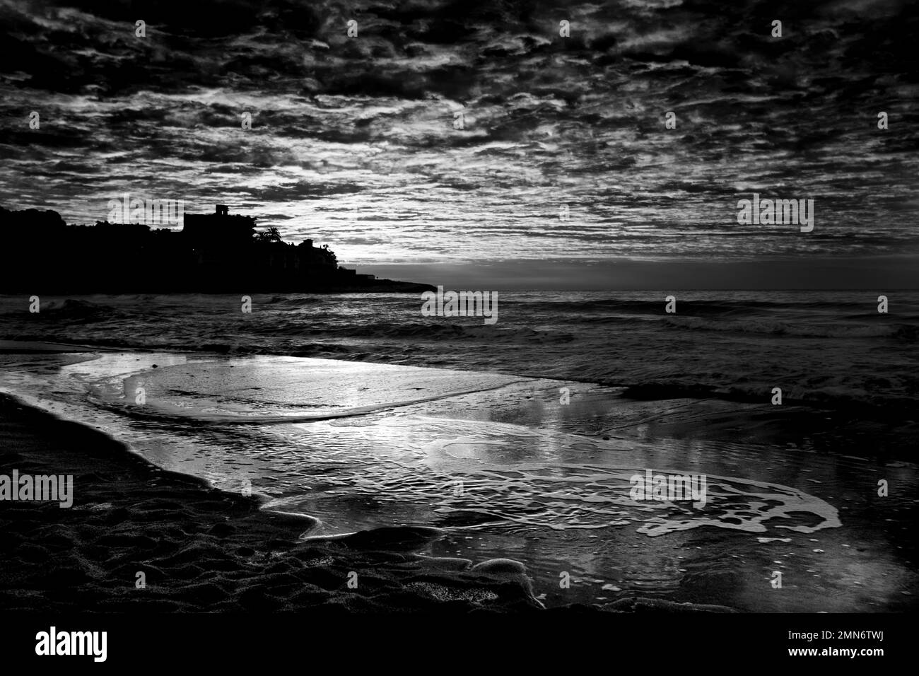 Dramatic black and white sea landscape image with dark sky and white ...