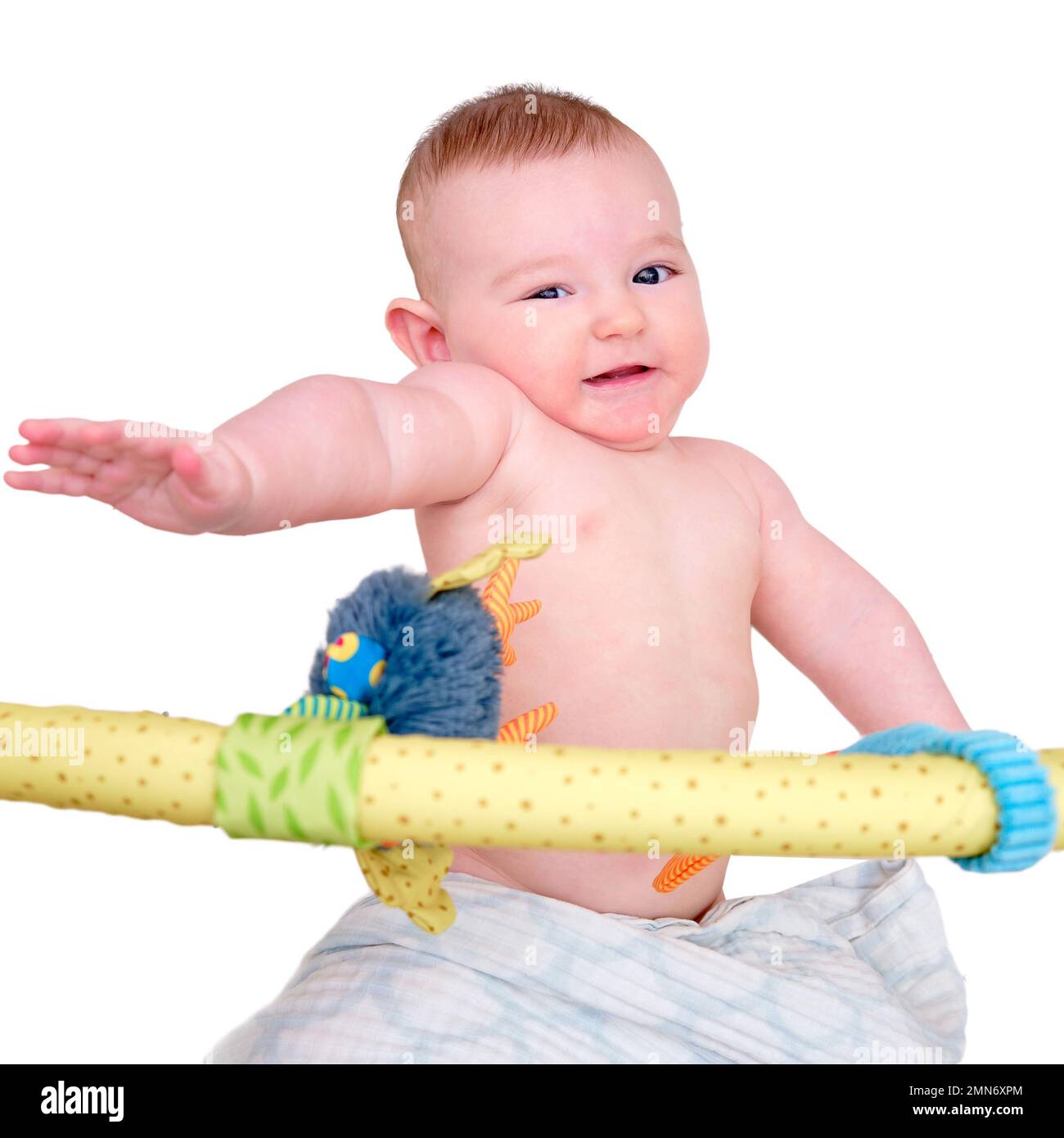 Infant baby refuses to play in bed with hanging toys, mobile above the ...