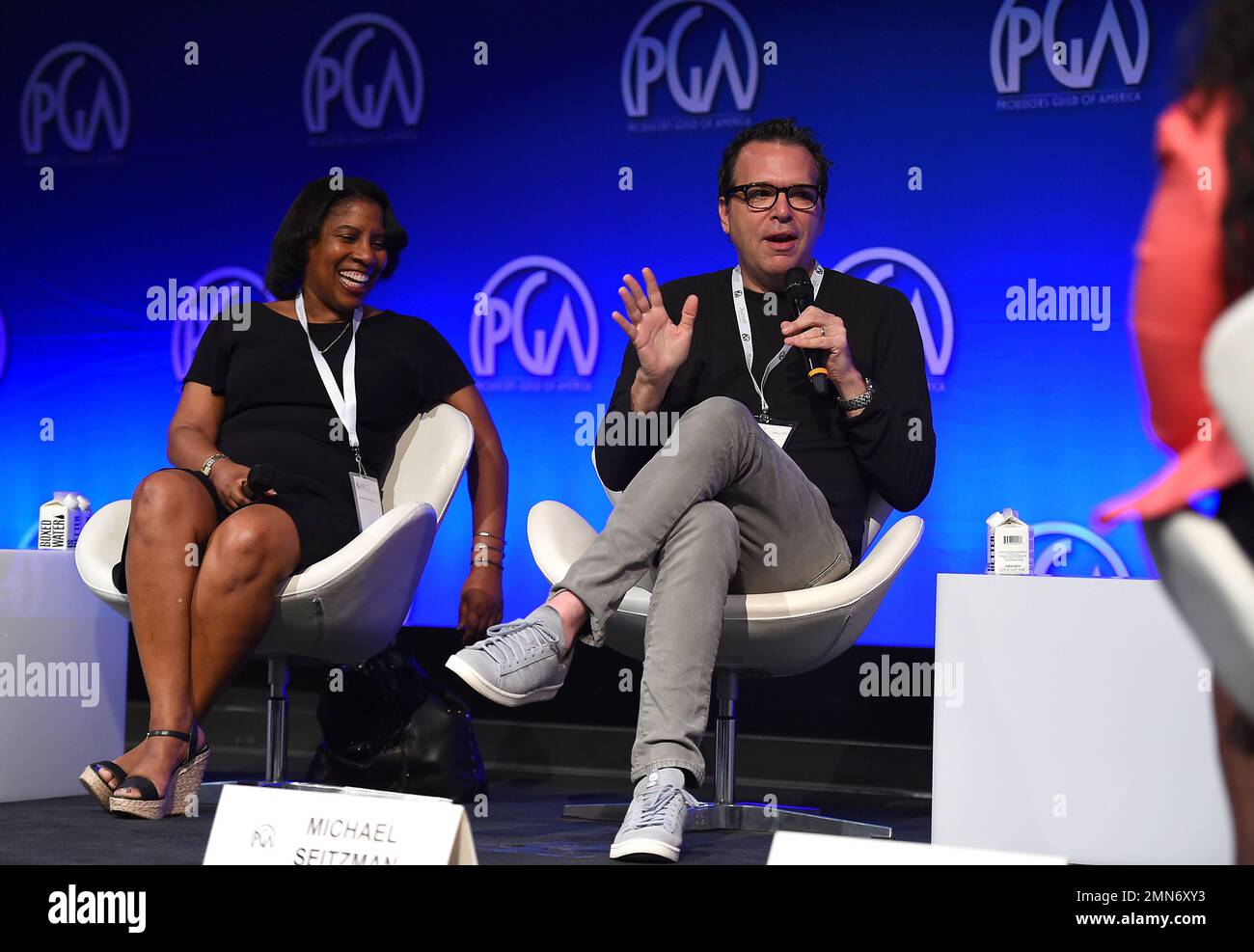 Rose Catherine Pinkney and Michael Seitzman listen to pitches during ...
