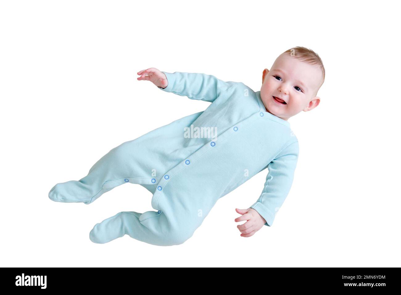 Happy baby lies in mint color clothes, isolated on a white background ...