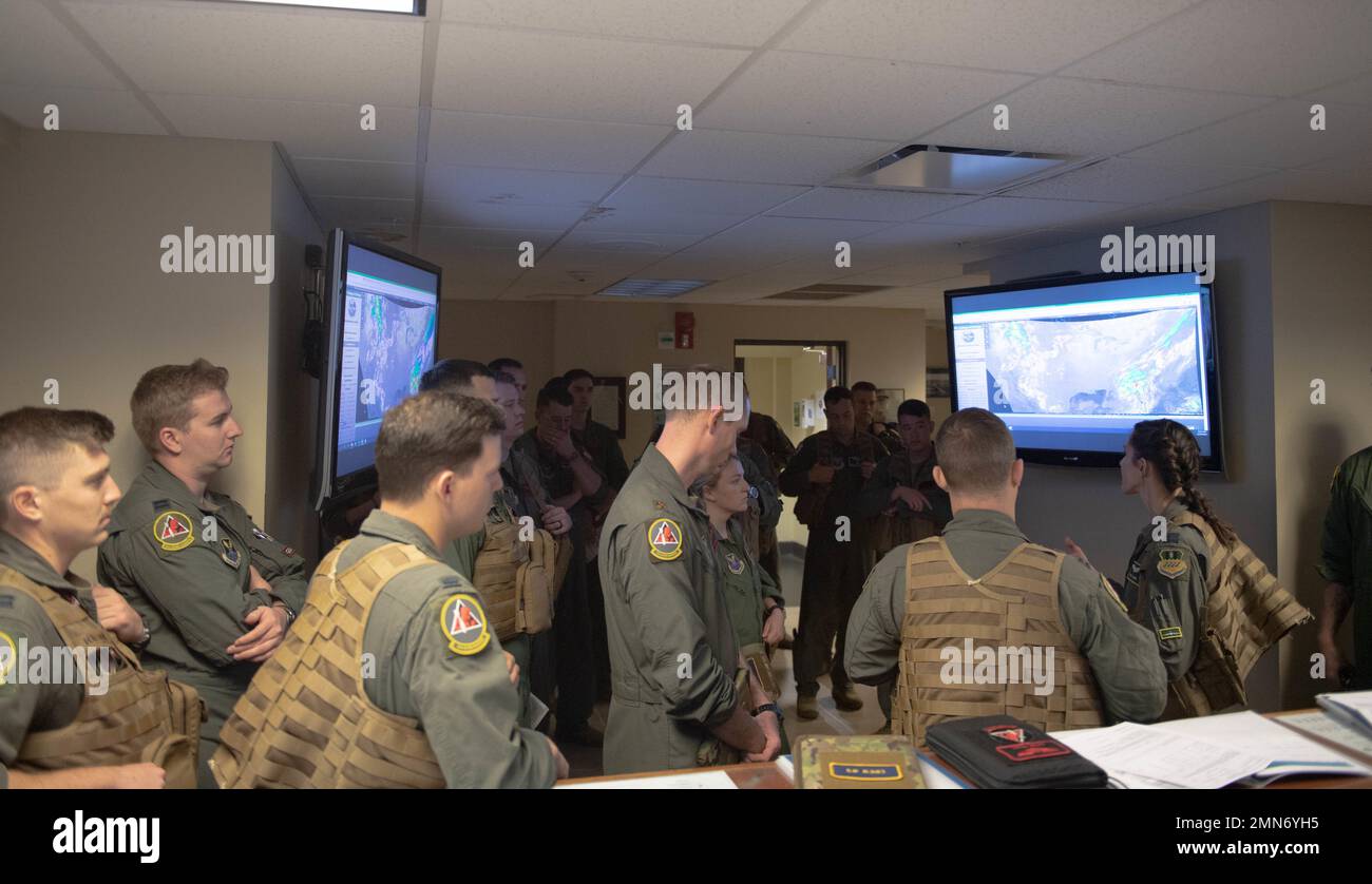 Aircrew from the 2nd Bomb Wing receive a brief before boarding a B-52H ...