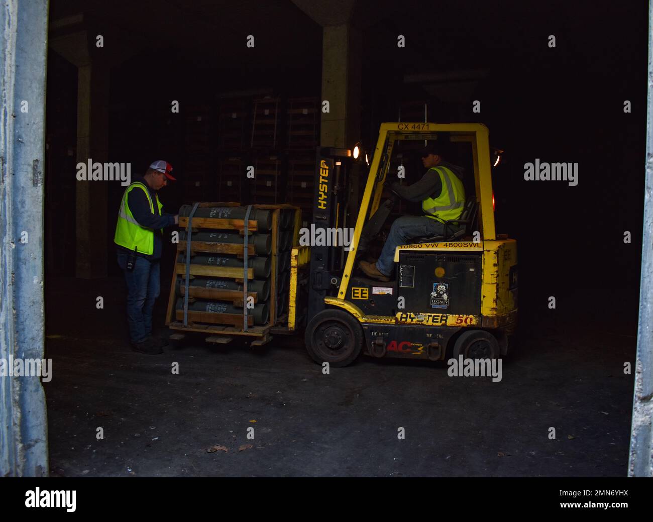 Explosive handlers at Crane Army Ammunition Activity load a railcar for ...